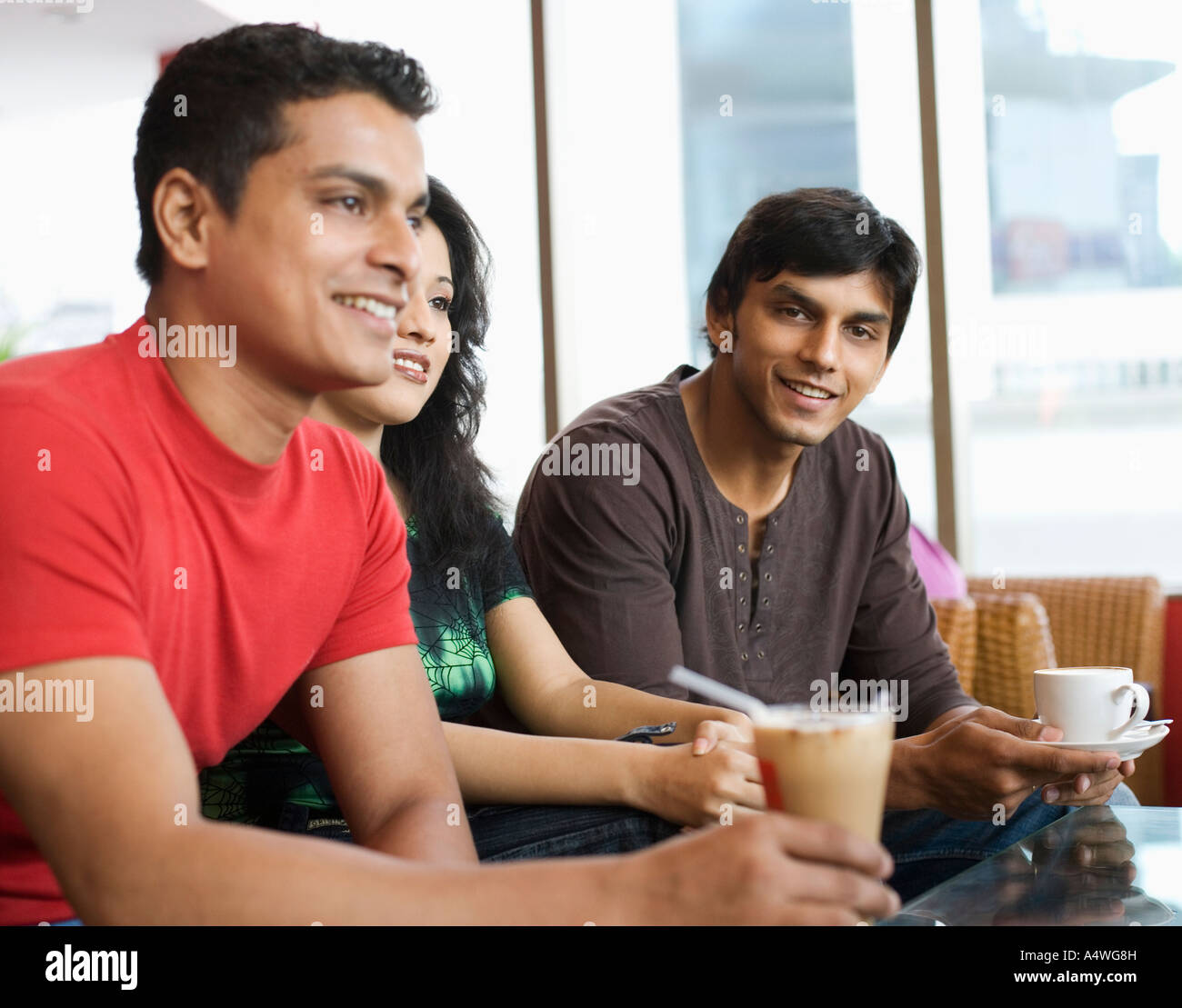 People drinking coffee in a cafe Stock Photo - Alamy