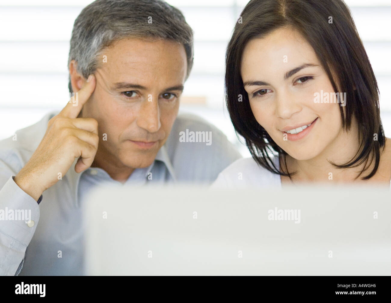 Man and woman using computer Stock Photo - Alamy