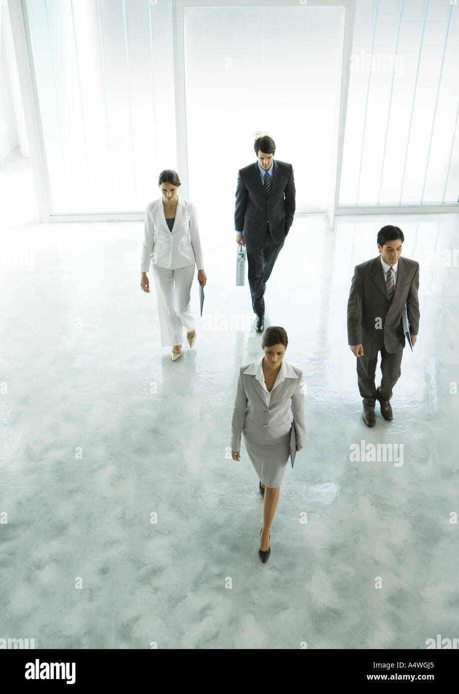 Business people walking through doorway hi-res stock photography and ...
