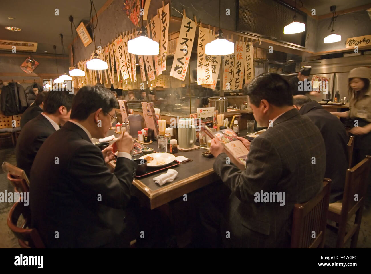 People eat a meal at an izakaya restaurant in Sapporo Hokkaido Japan ...