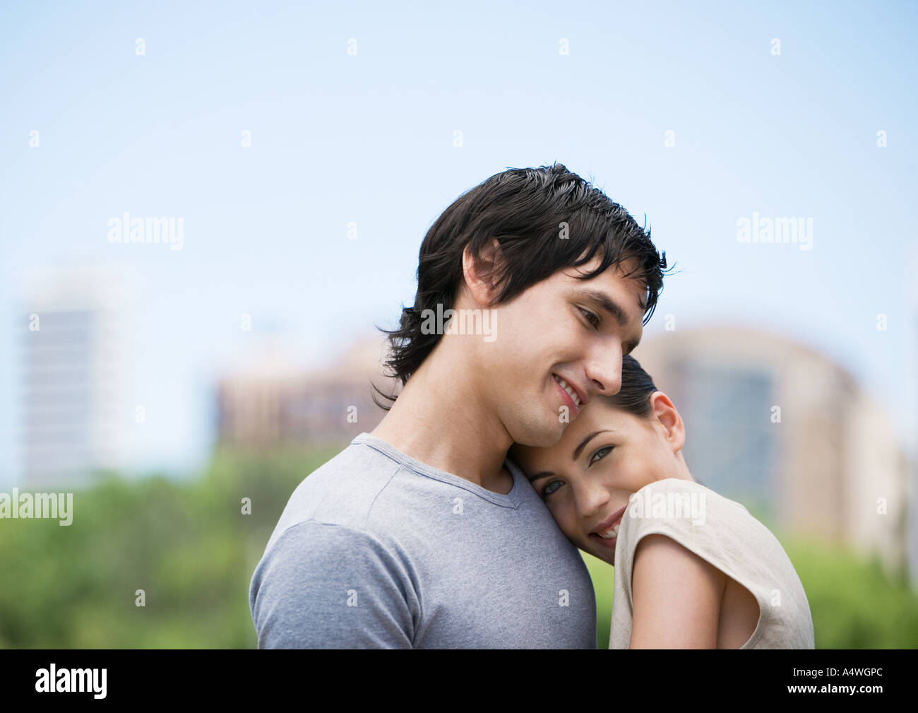 Young woman resting head on boyfriend's shoulder Stock Photo - Alamy