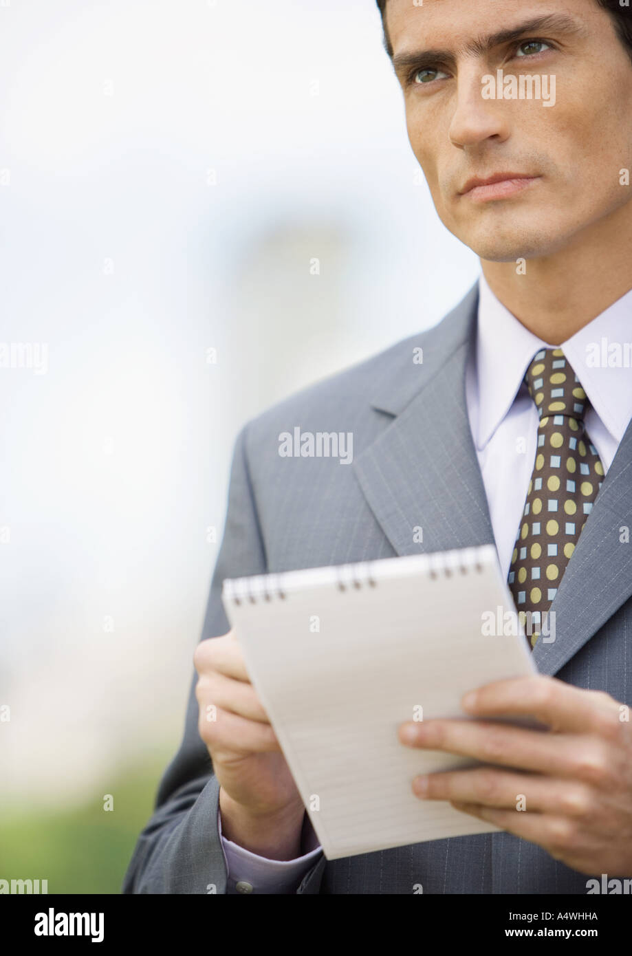 Businessman taking notes Stock Photo - Alamy