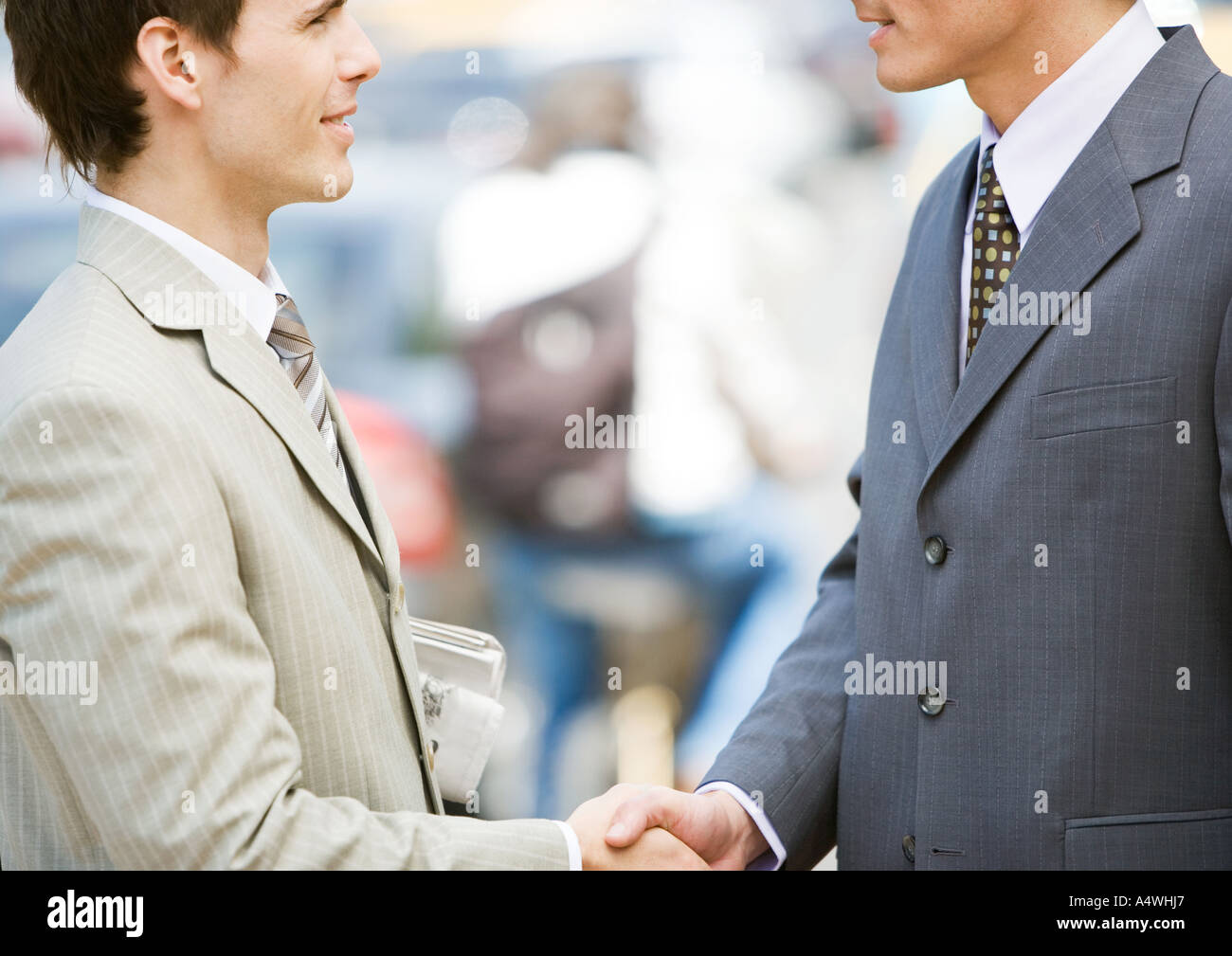 Two businessmen shaking hands Stock Photo - Alamy
