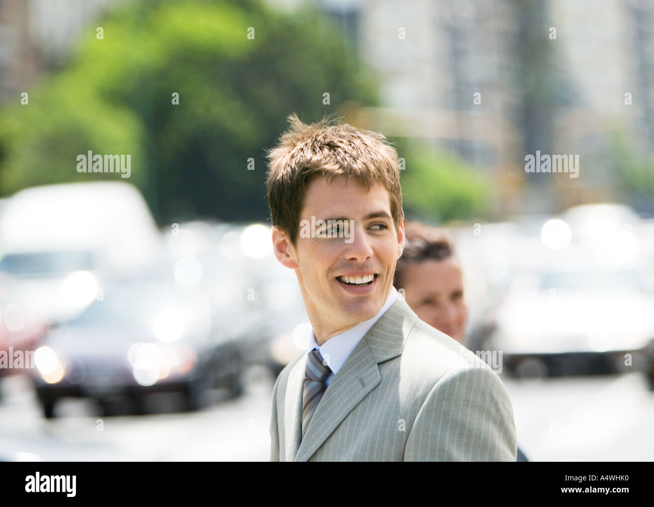 Businessman in street, looking over shoulder Stock Photo - Alamy