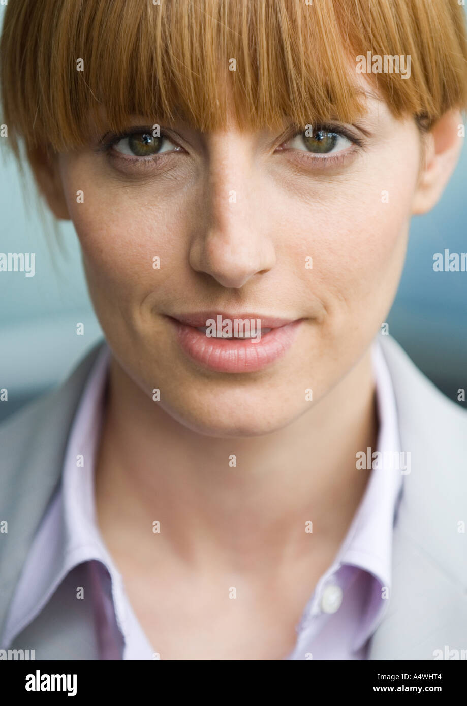 Woman with bangs smiling, portrait Stock Photo - Alamy