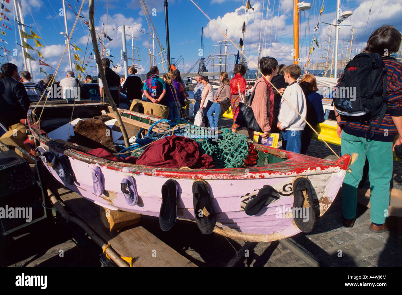 Pink Rowing Boat with Shoes and fishing nets at the Tall Ships Race in ...