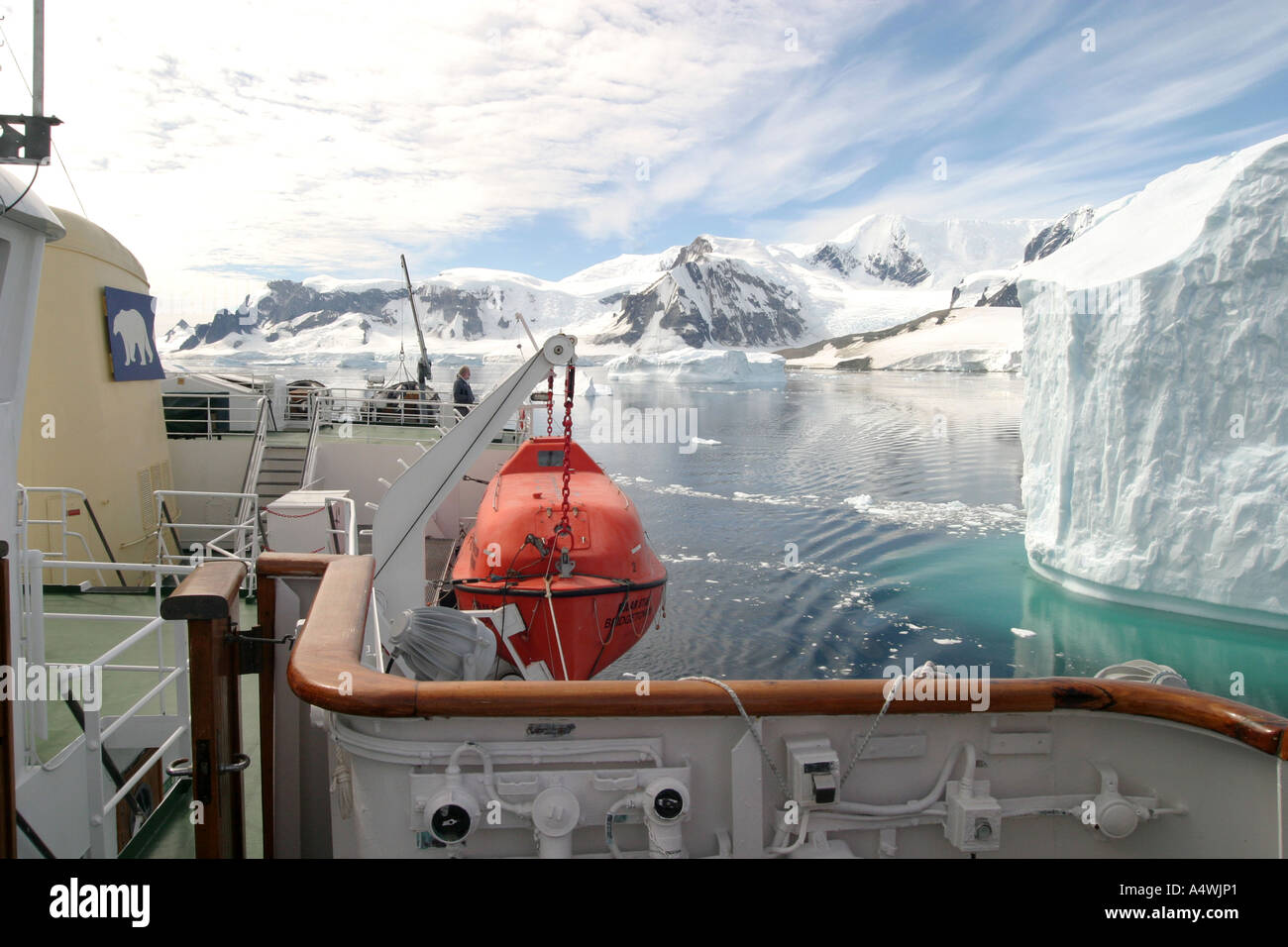 View of towering ice cliffs from the deck of an icebreaker cruise ship ...