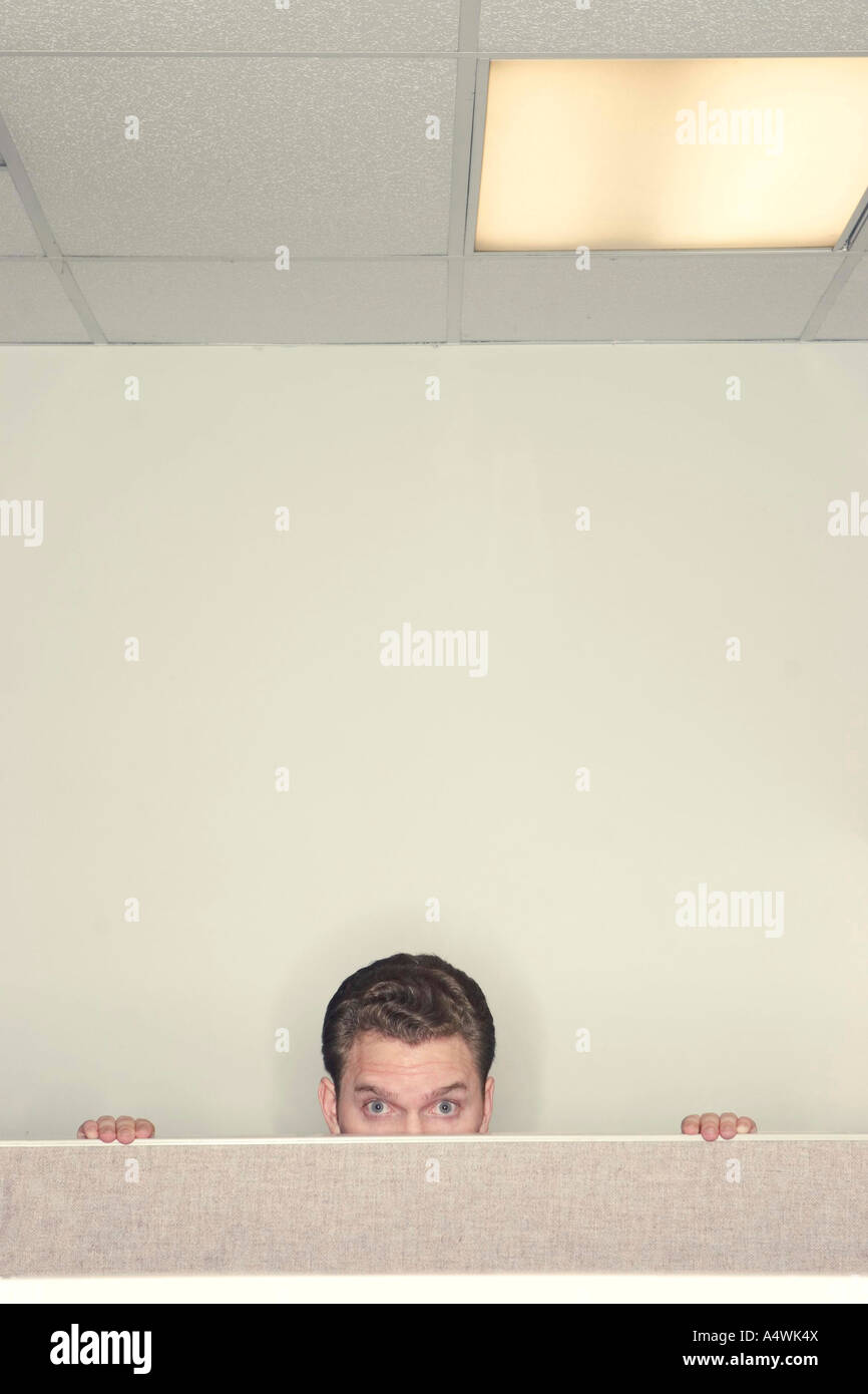 Man peeking over wall hi-res stock photography and images - Alamy