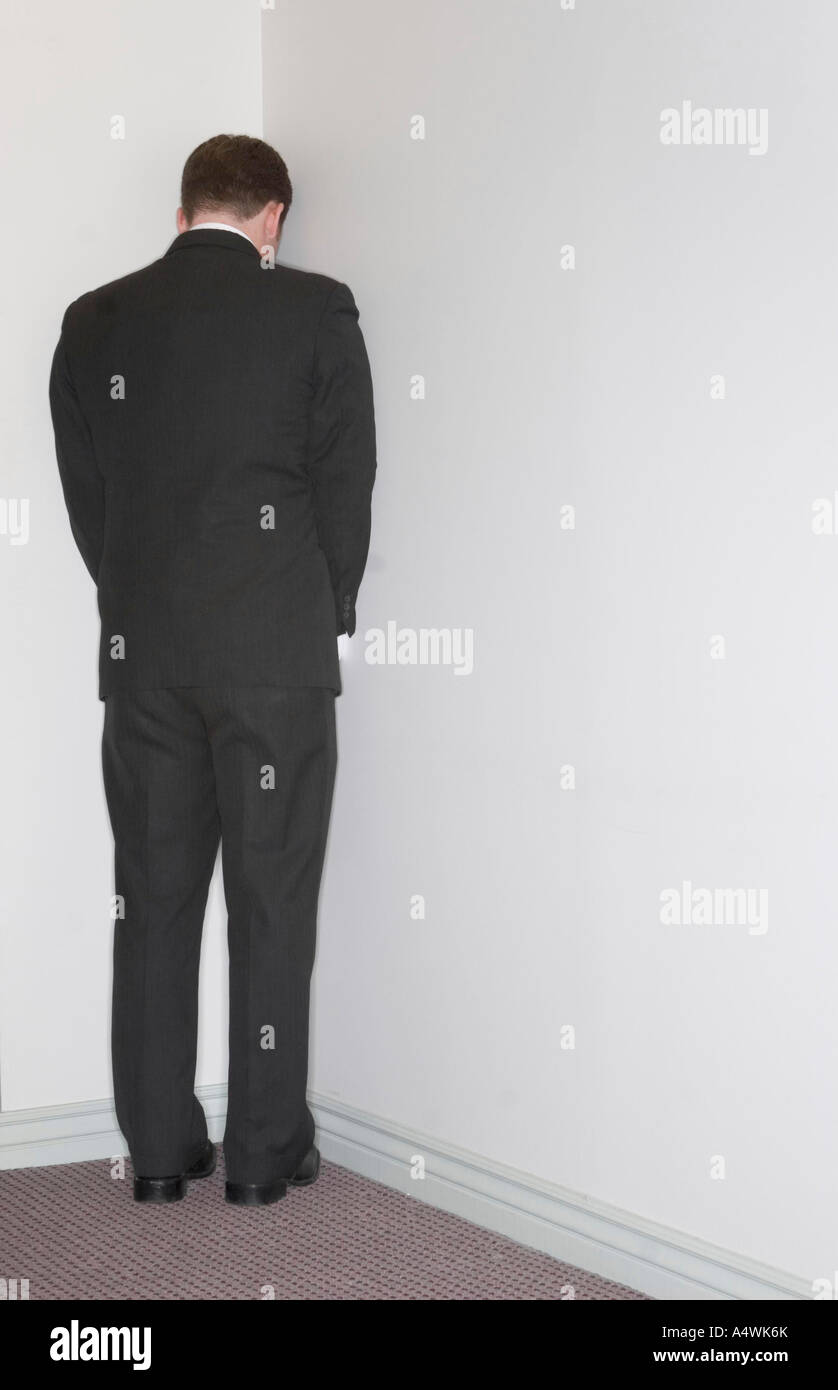 Person standing alone in corner hi-res stock photography and images - Alamy