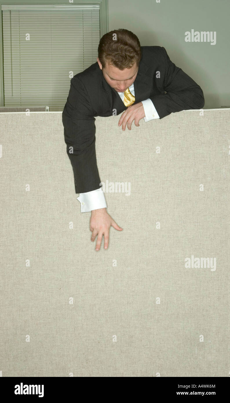 Businessman leaning over cubicle hi-res stock photography and images ...