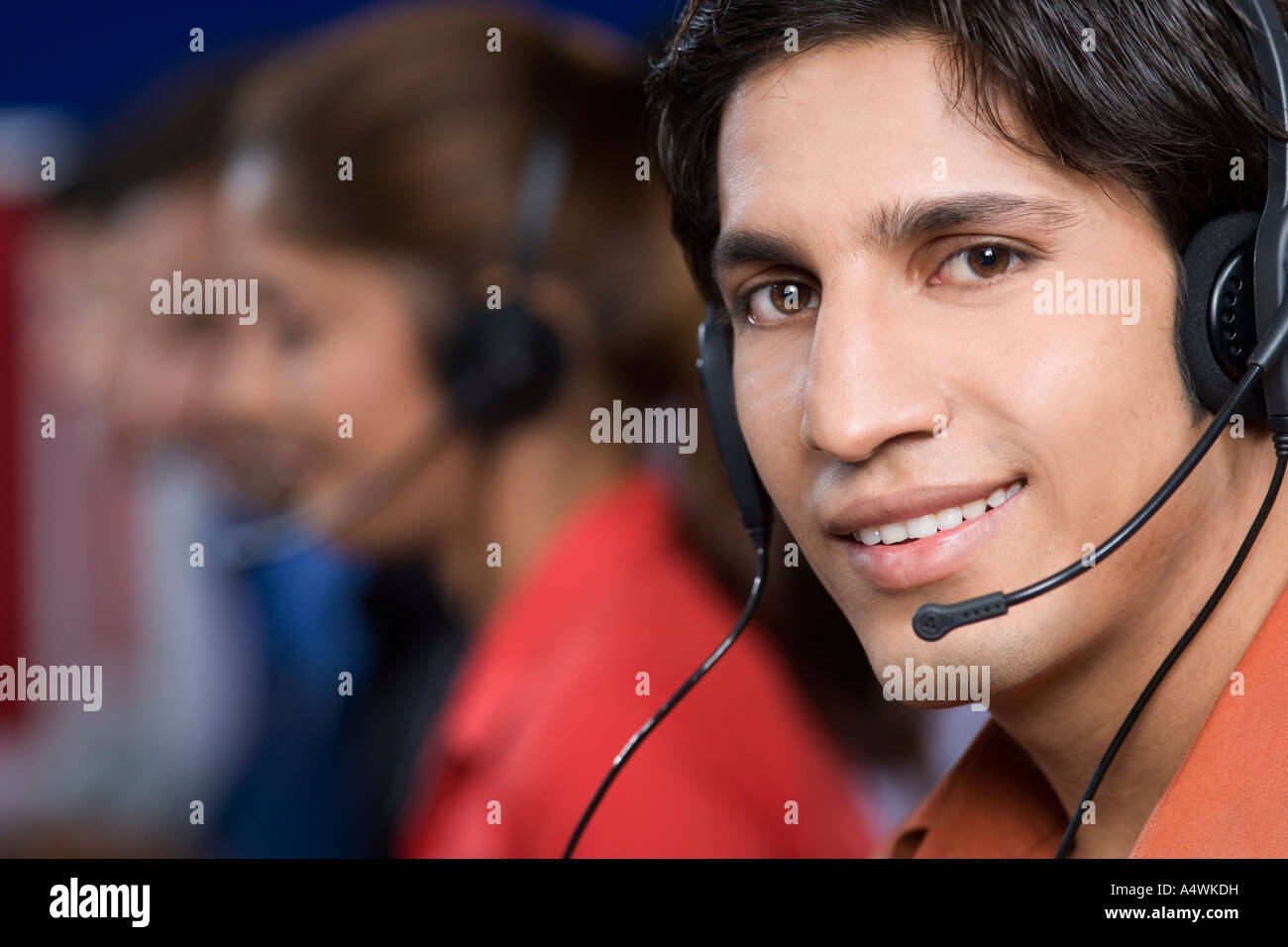Businessman wearing a headset while working Stock Photo - Alamy