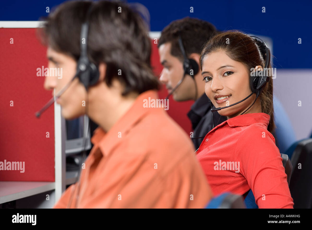 Businesswoman wearing a headset while relaxing at work Stock Photo - Alamy