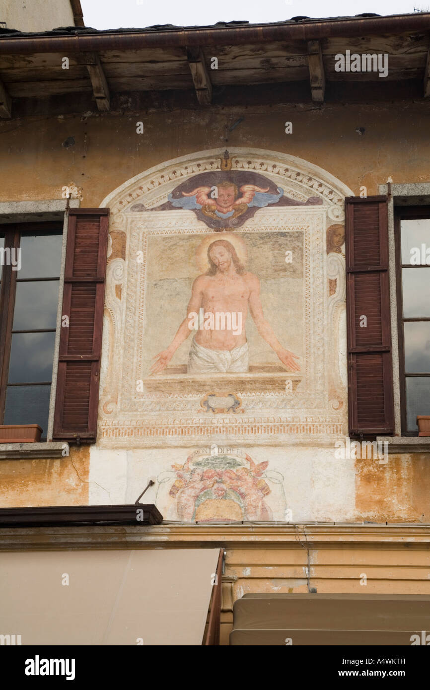Religious fresco with Gesus Christ on the front wall of a house - Orta ...