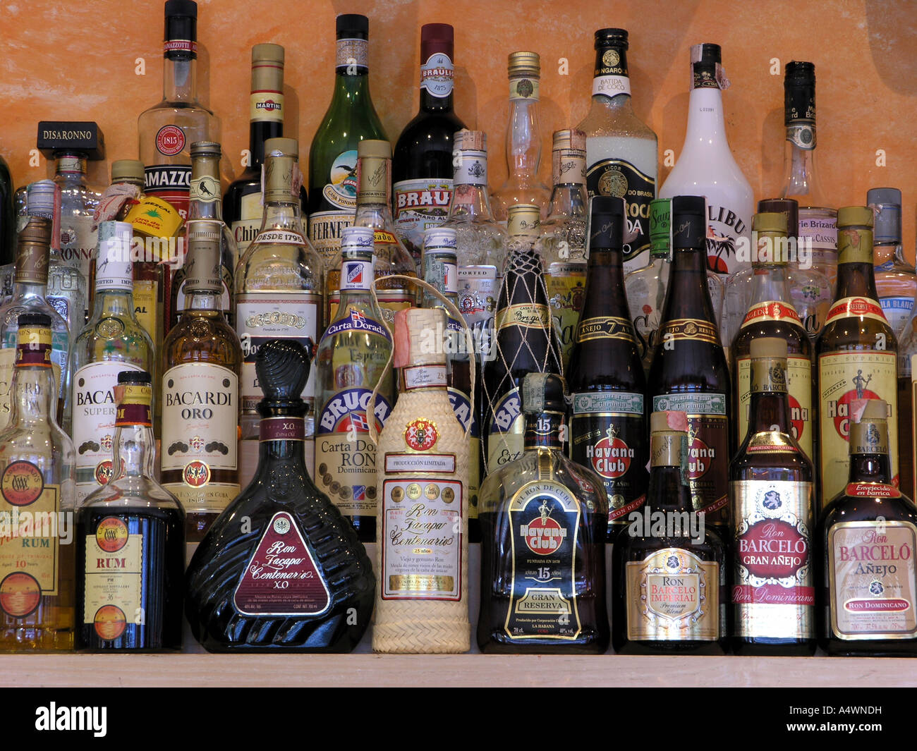 Bar rack with bottles Stock Photo - Alamy