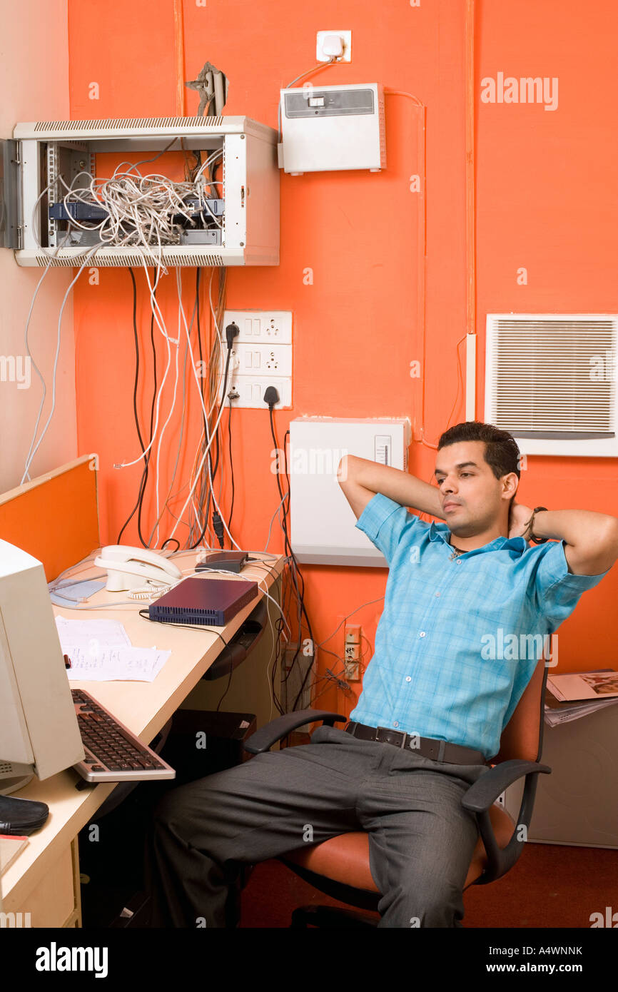 Man desk leaning back hands hi-res stock photography and images - Alamy