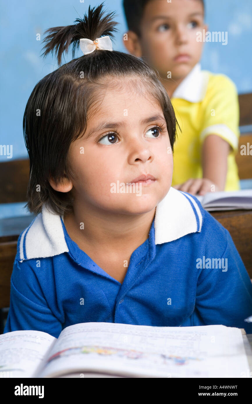 Young girl sitting in classroom Stock Photo - Alamy
