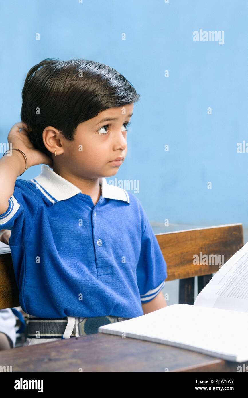 Young girl sitting in classroom Stock Photo - Alamy