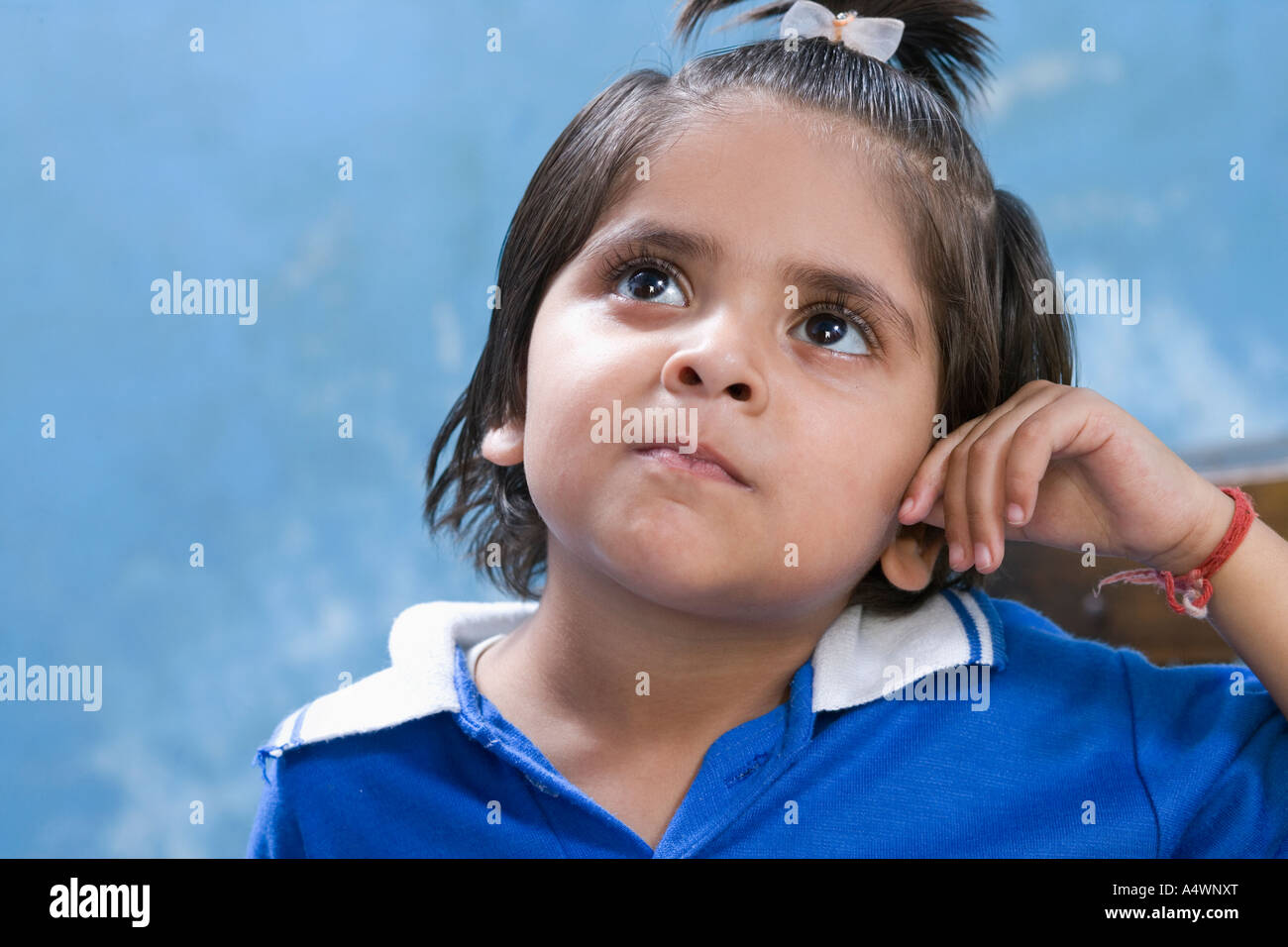 Young girl thinking Stock Photo - Alamy