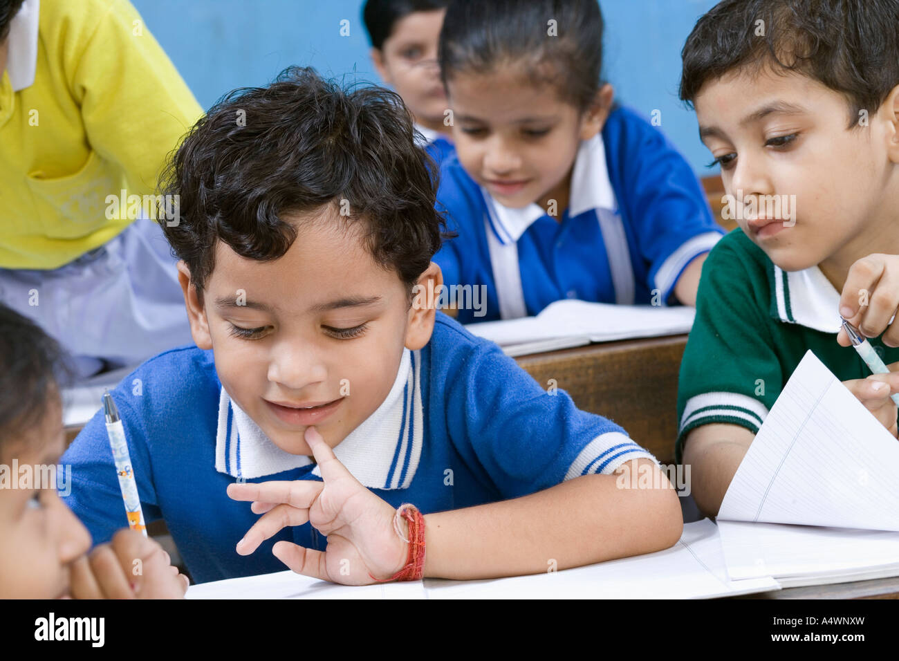 Children working in classroom Stock Photo - Alamy
