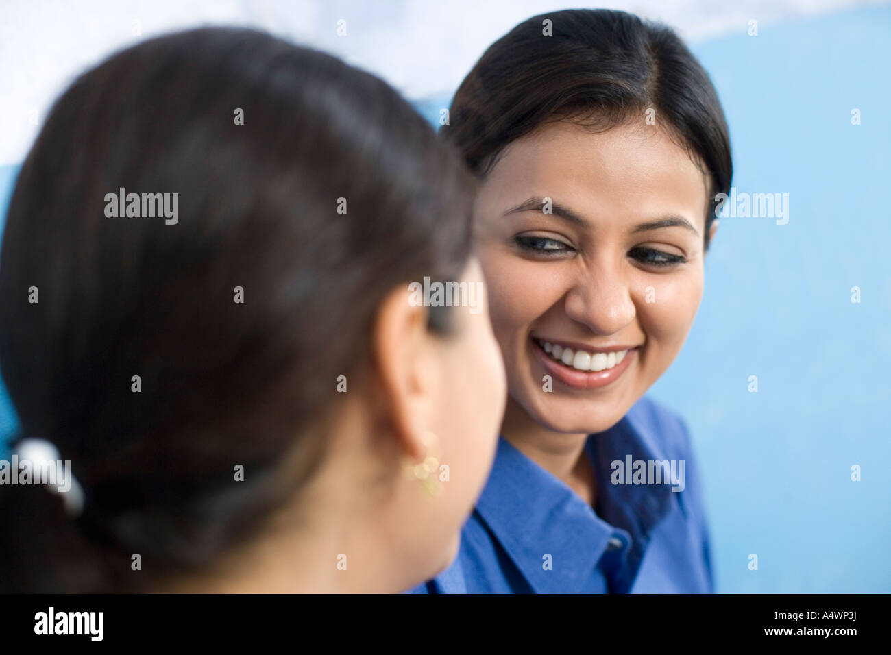 Teenage girls talking Stock Photo - Alamy