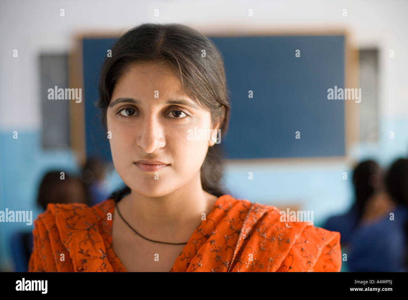 Teacher in classroom Stock Photo - Alamy