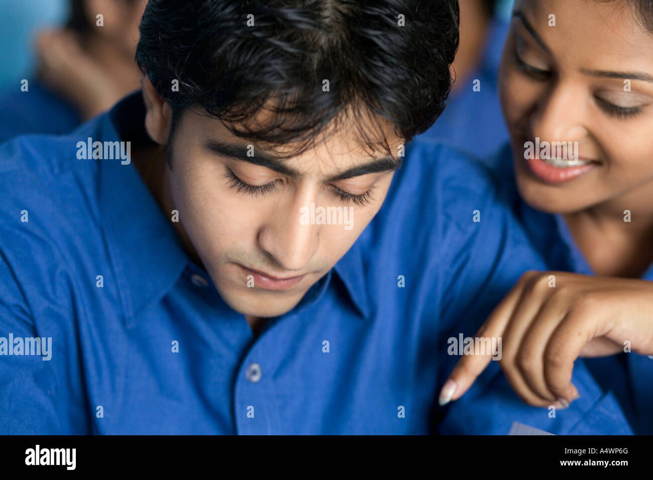 Classmate helping friend hi-res stock photography and images - Alamy