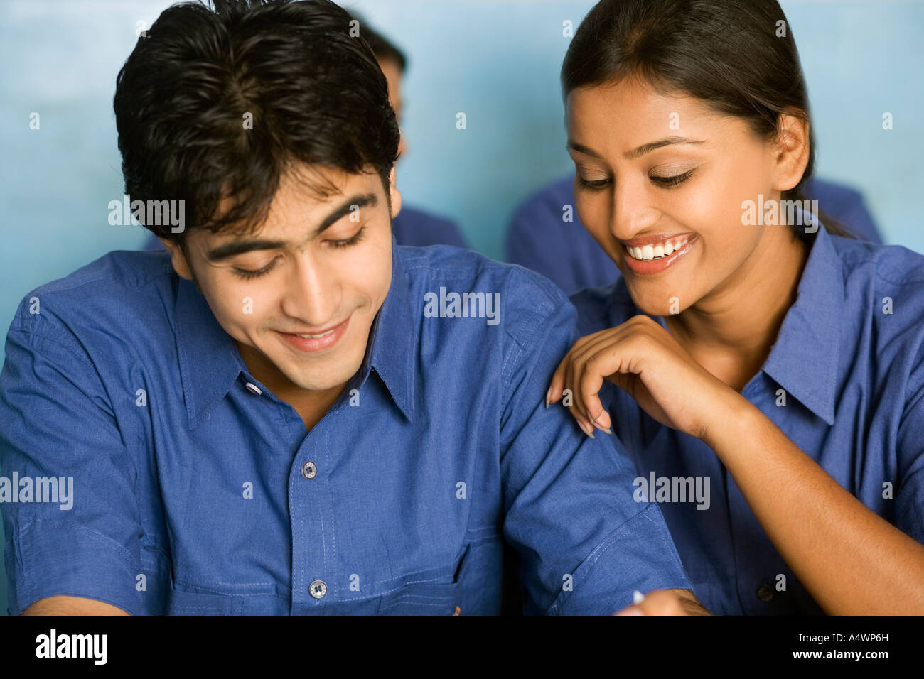 Students talking in classroom Stock Photo - Alamy