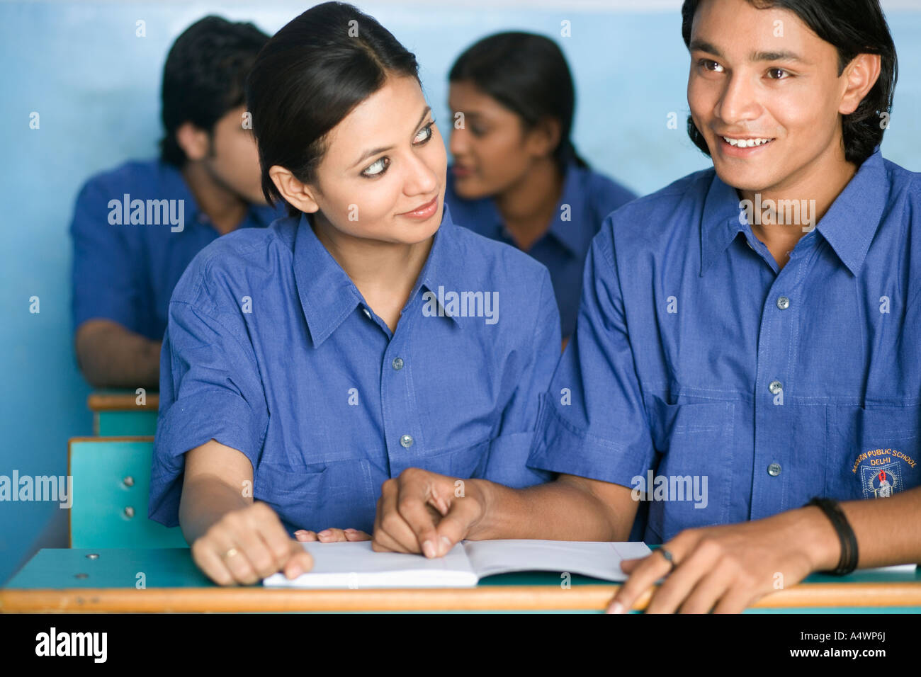 Students talking in classroom Stock Photo - Alamy