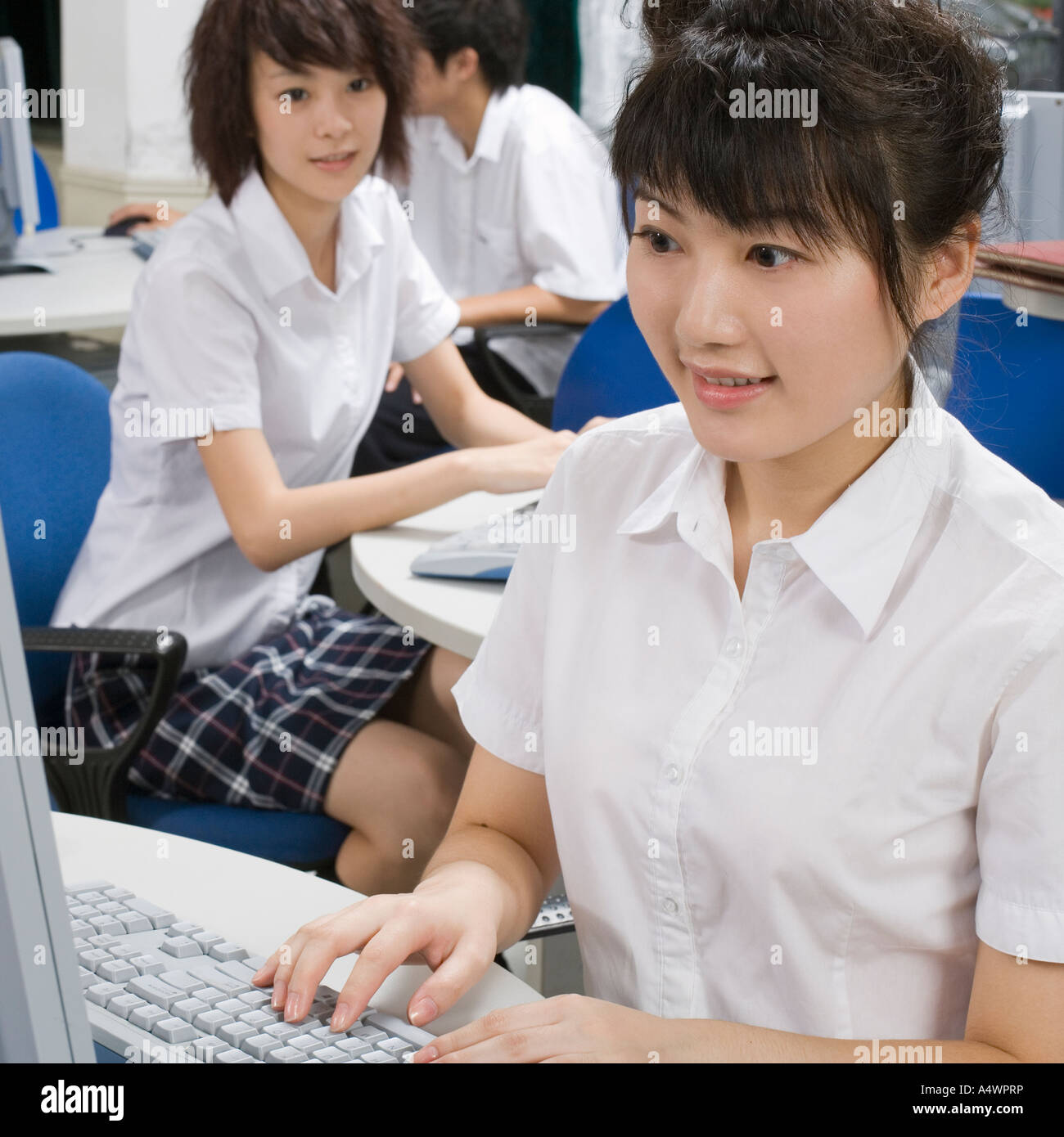 Female student working at a computer Stock Photo - Alamy