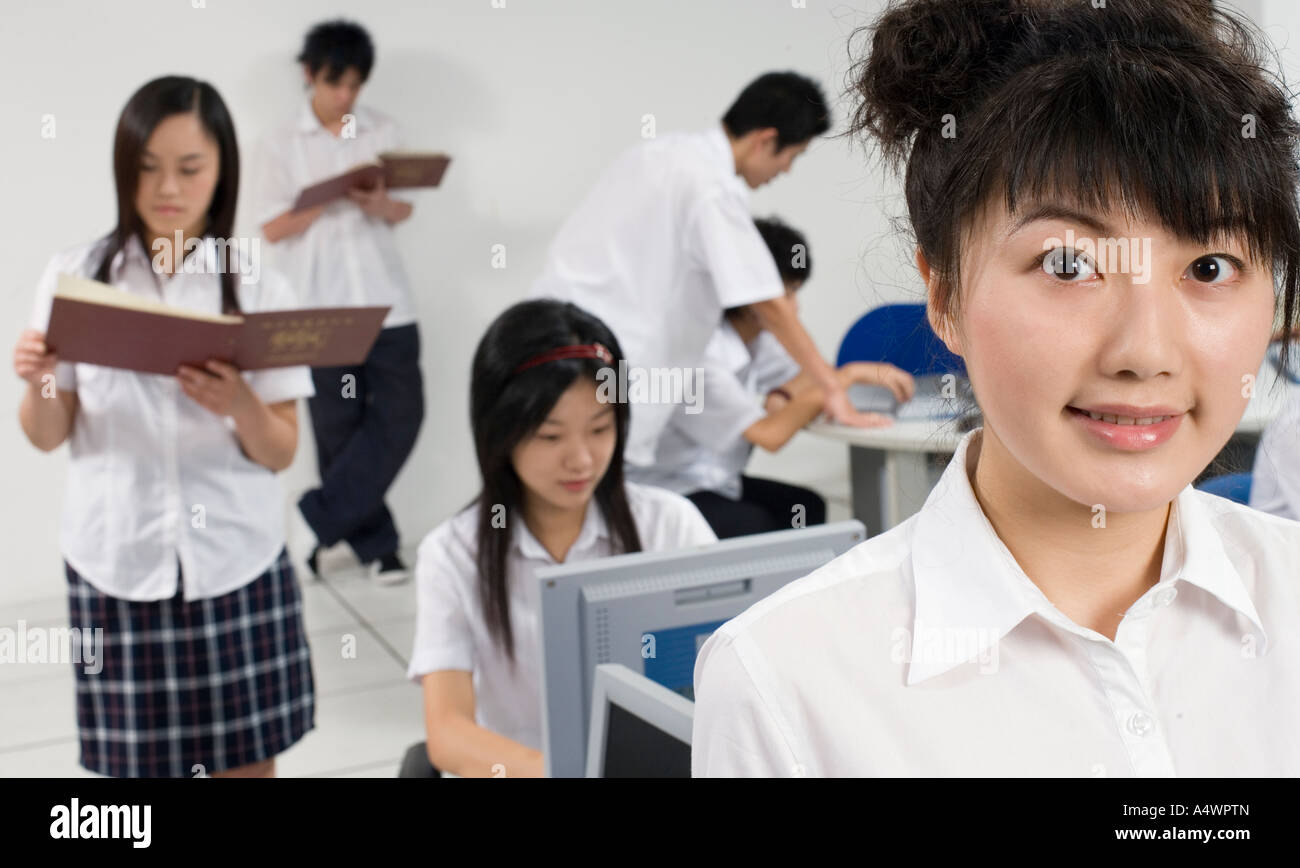 Female student smiling in computer lab Stock Photo - Alamy