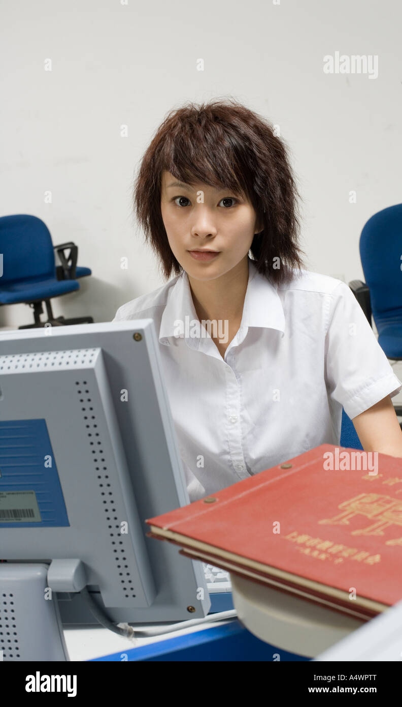 Female student working at a computer Stock Photo - Alamy