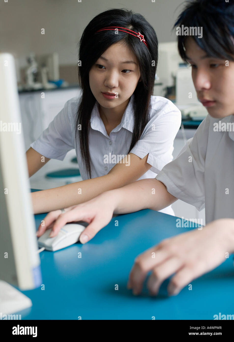 Students working at a computer Stock Photo - Alamy