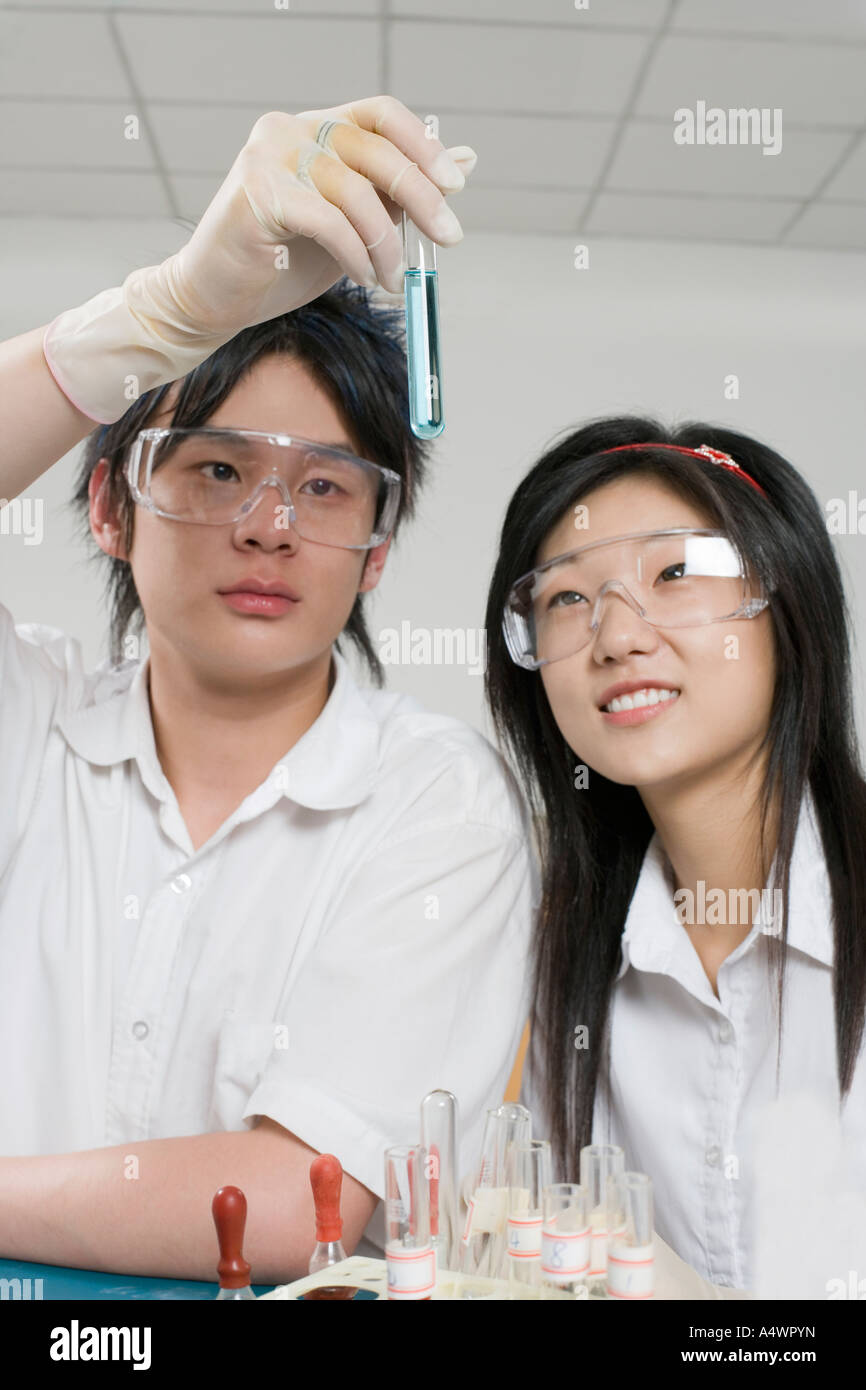 Students examining the contents of test tubes Stock Photo - Alamy