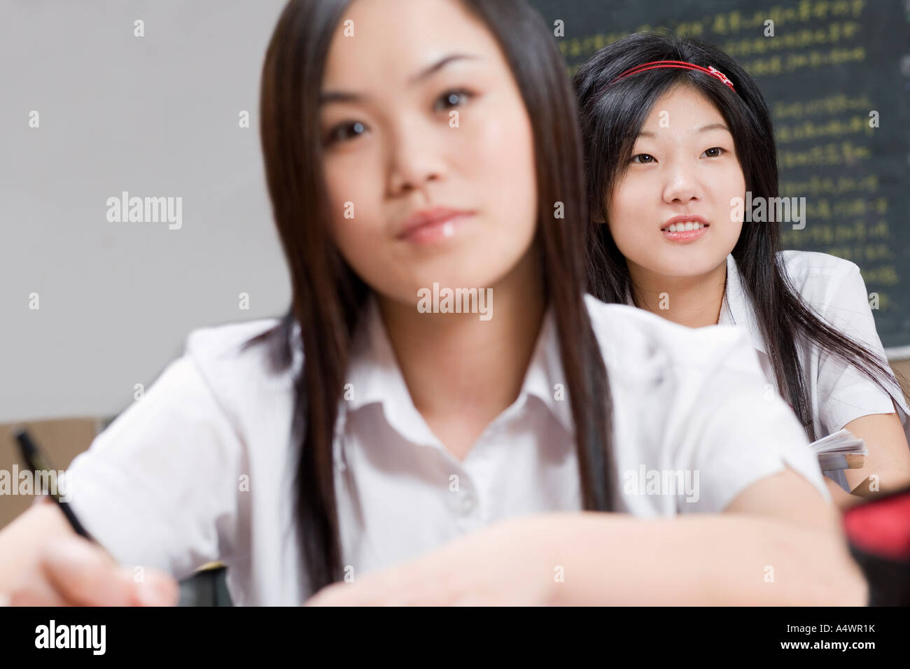Female student taking notes in class Stock Photo - Alamy