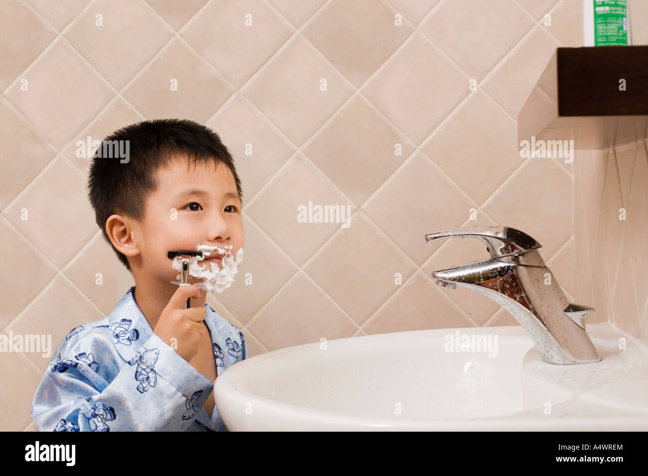 Young boy shaving Stock Photo - Alamy