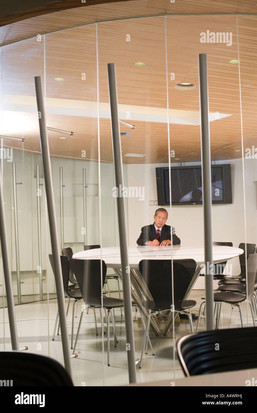 Businessman sitting in conference room Stock Photo - Alamy