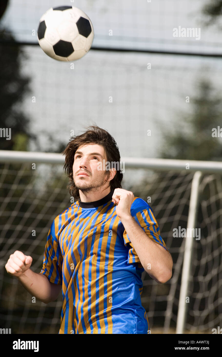 Soccer player heading the ball Stock Photo - Alamy