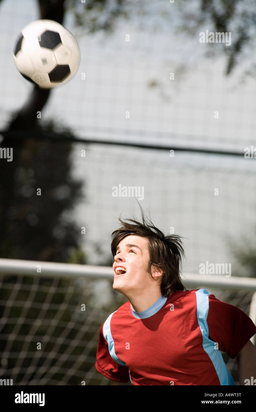 Soccer player heading the ball Stock Photo - Alamy