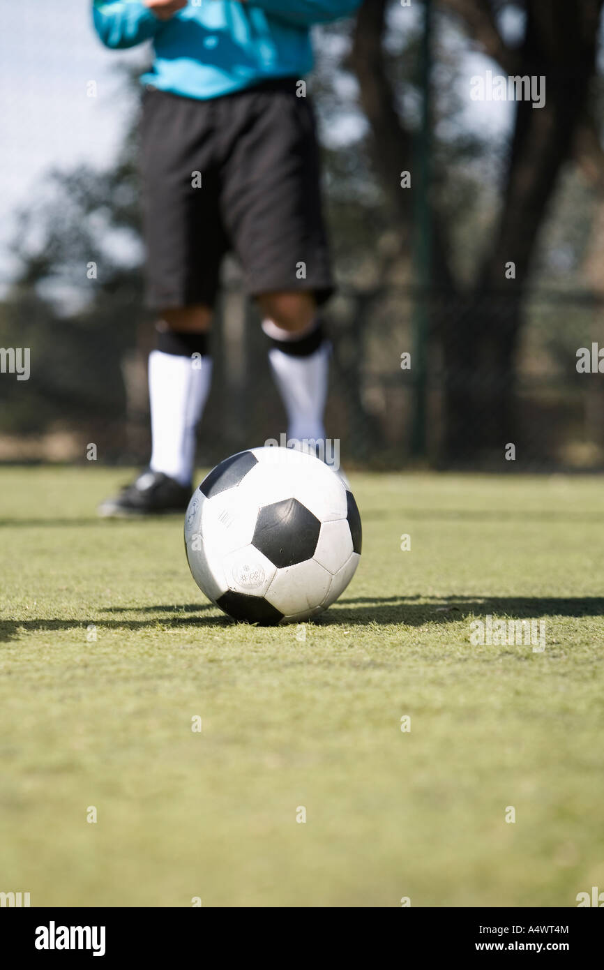 Soccer ball resting on field Stock Photo - Alamy