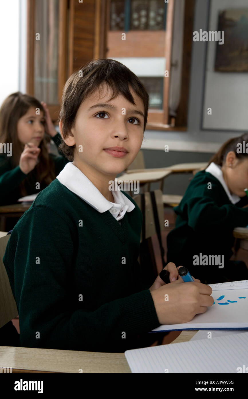 Young student doodling in class Stock Photo - Alamy
