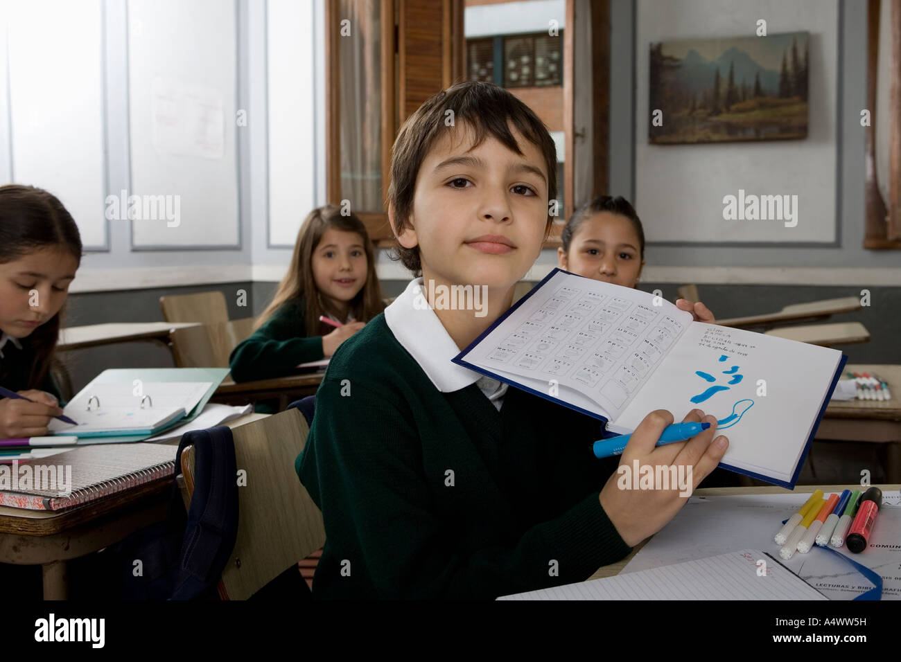 Young student doodling in class Stock Photo - Alamy