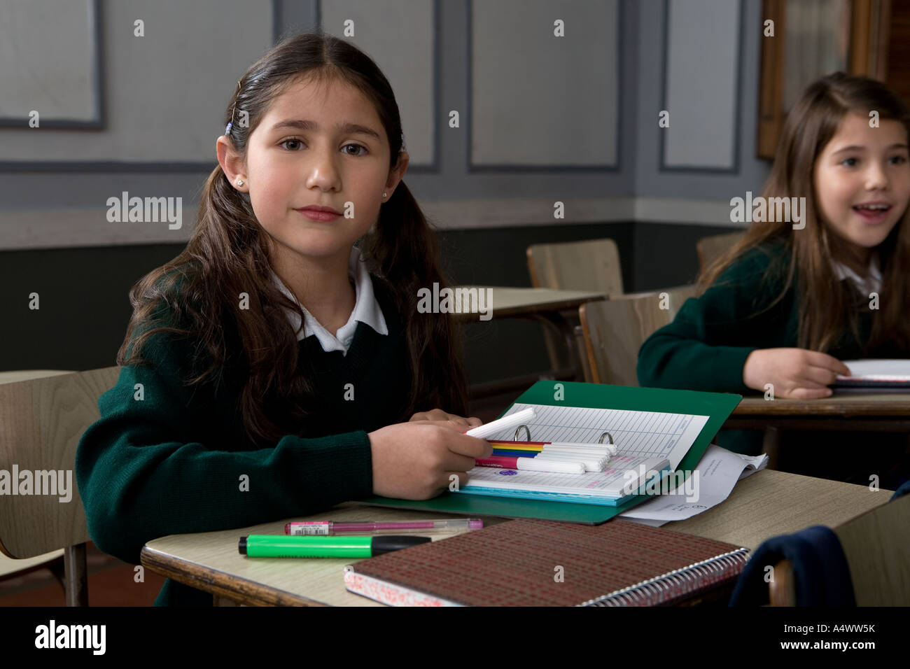 Young student using markers at her desk Stock Photo - Alamy