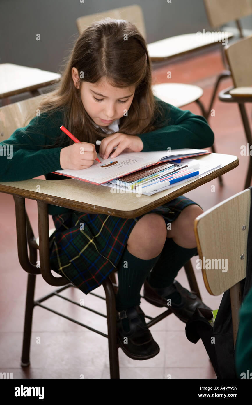 Young student doodling in class Stock Photo - Alamy