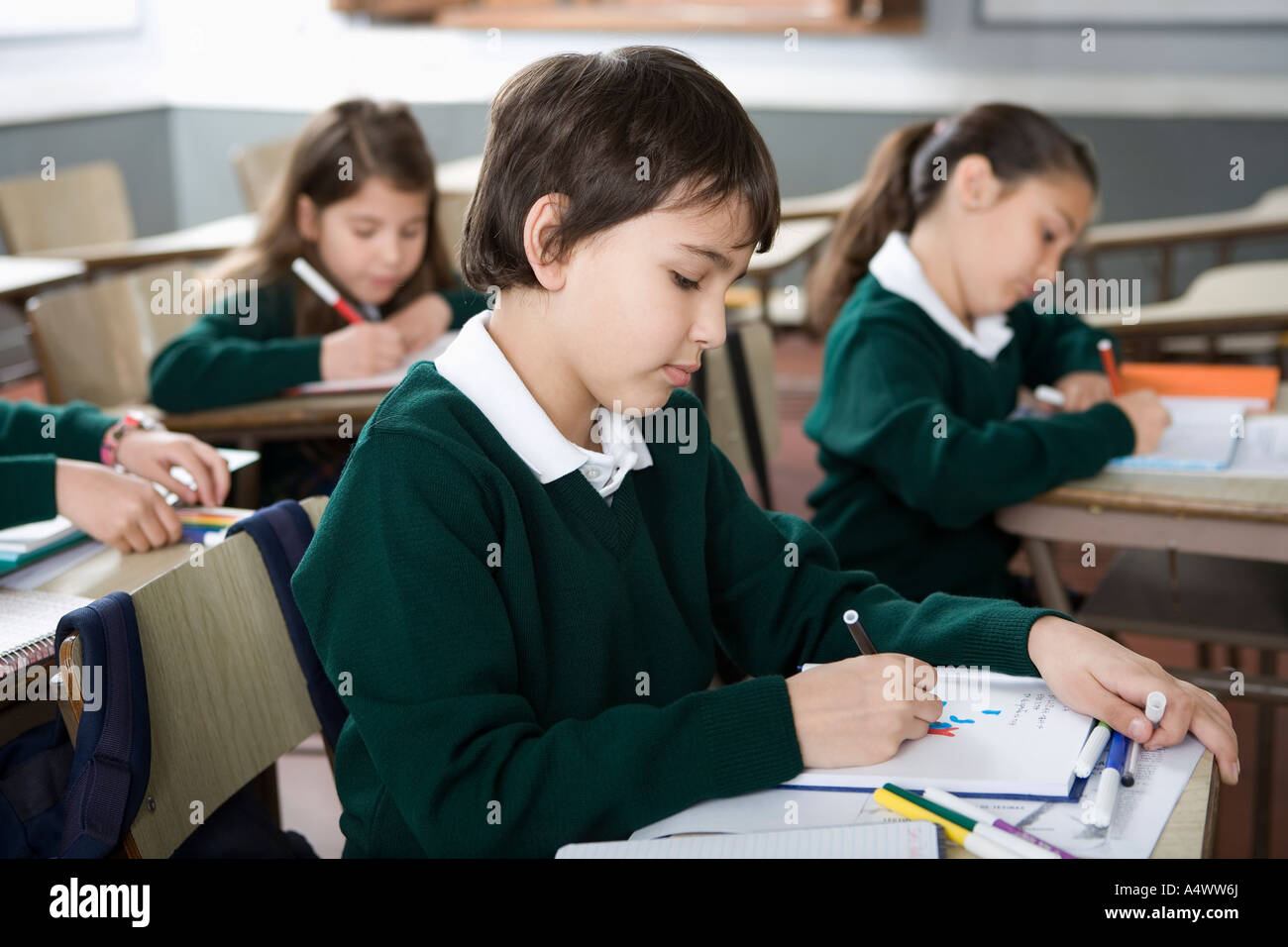 Young student drawing in class Stock Photo - Alamy