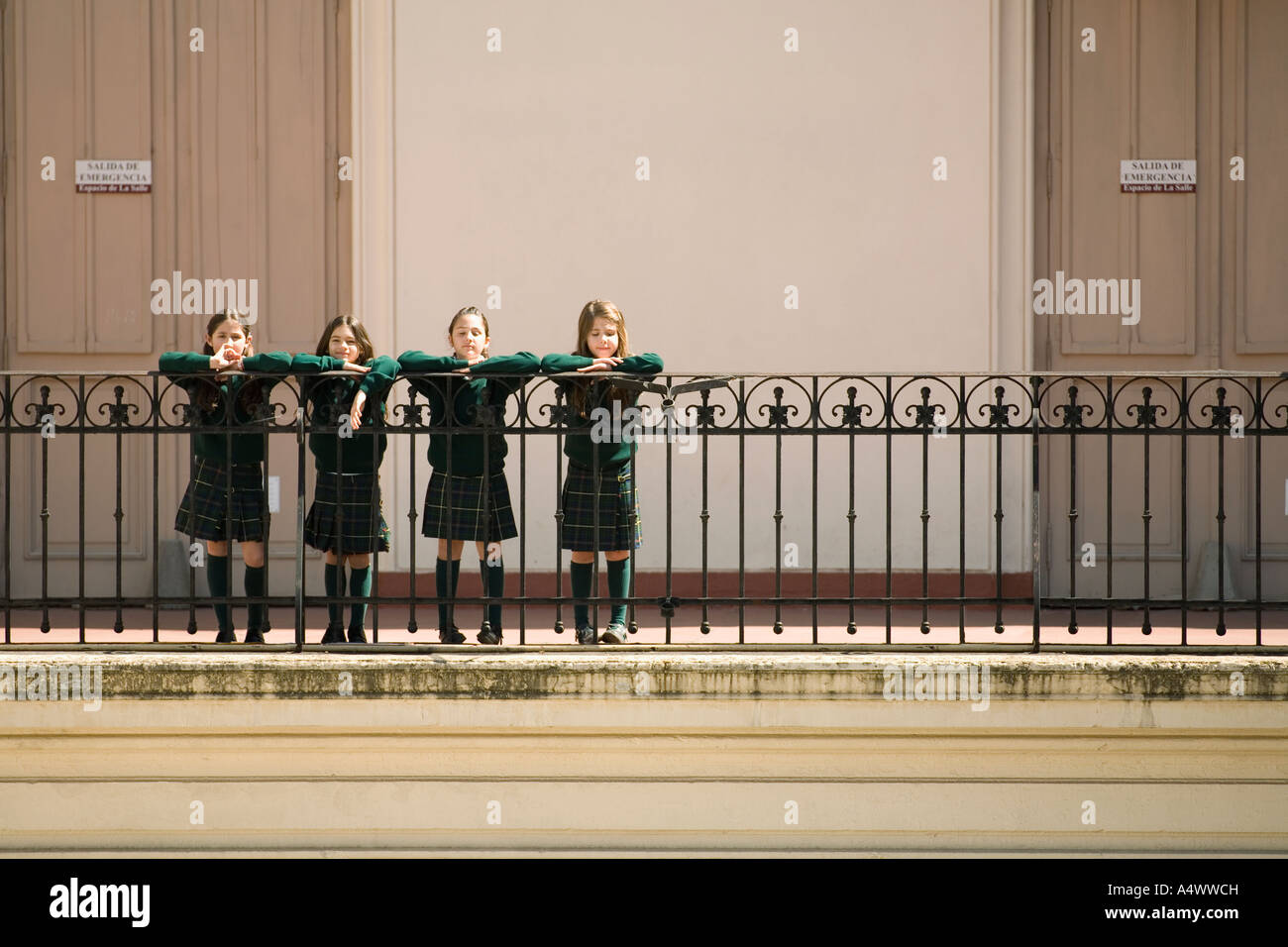 Young students standing on balcony Stock Photo - Alamy
