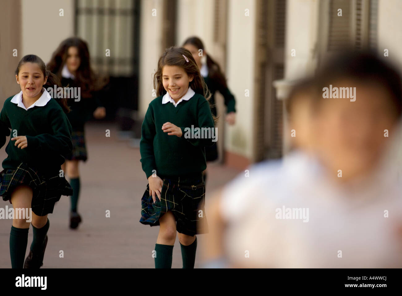 Young students running in playground Stock Photo - Alamy