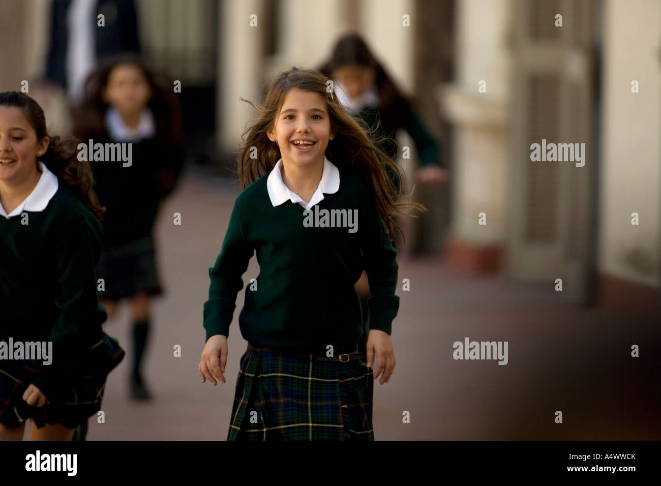 Young students running in playground Stock Photo - Alamy