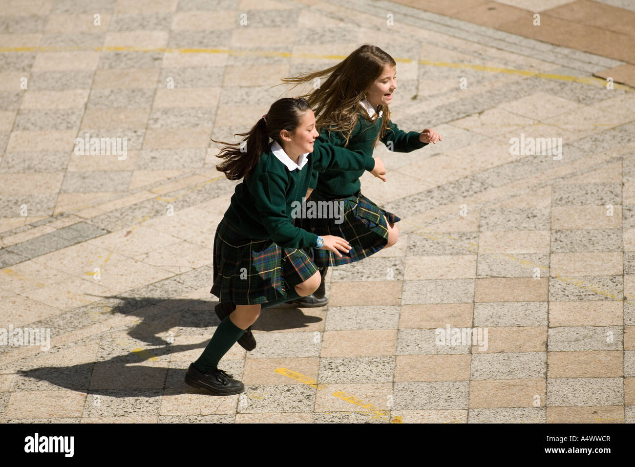 Students running in playground in courtyard Stock Photo - Alamy