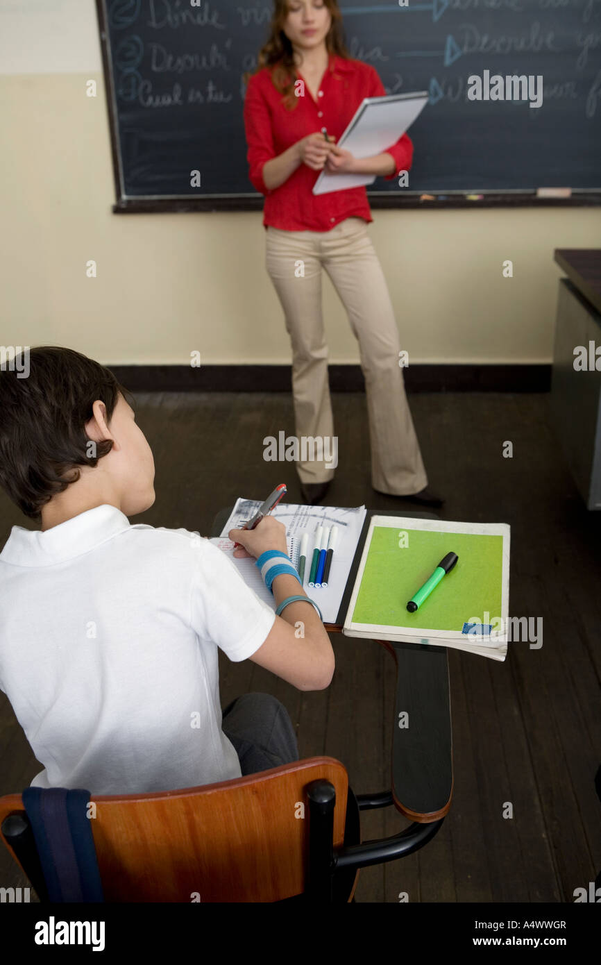 Young student taking notes in class Stock Photo - Alamy