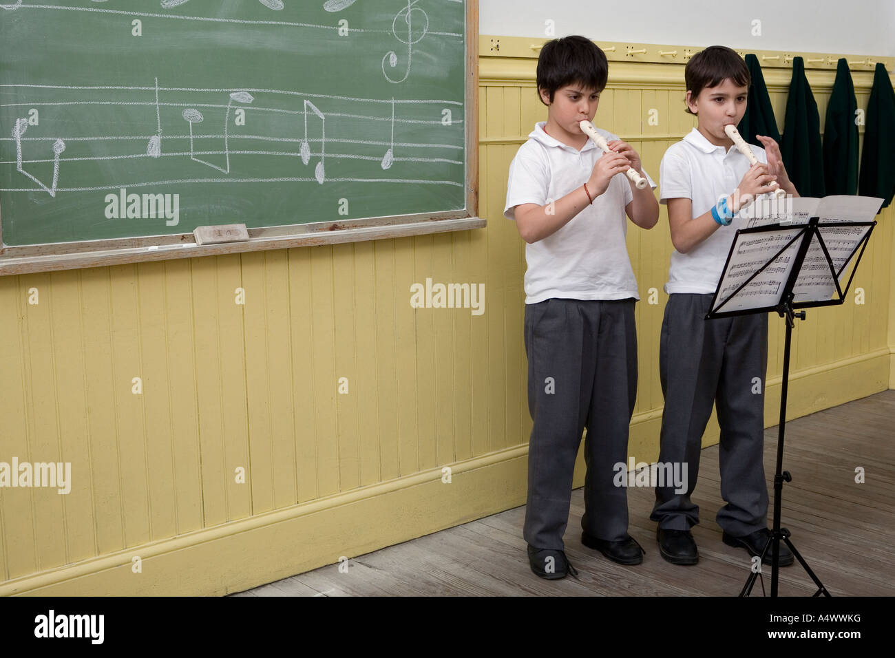 Young students learning to play the recorder Stock Photo - Alamy
